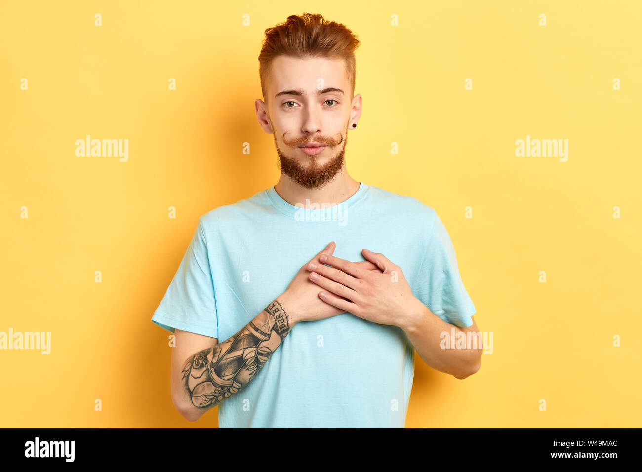 handsome awesome guy with funny moustache smiles and looks at the ...