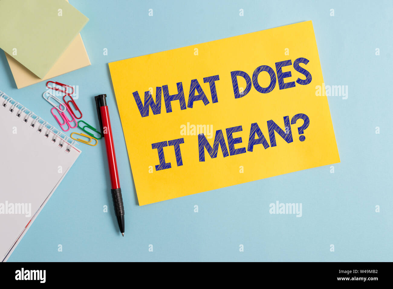 Writing note showing What Does It Mean question. Business concept for ...