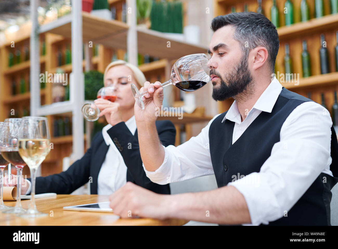 Professional sommelier tasting wine in restaurant hi-res stock ...