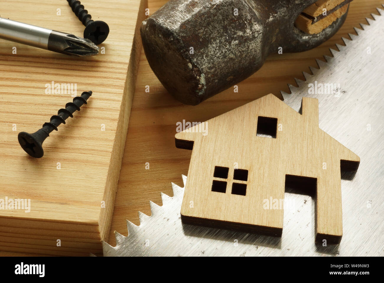 Construction of home and renovation concept. Hand saw, hammer and ...