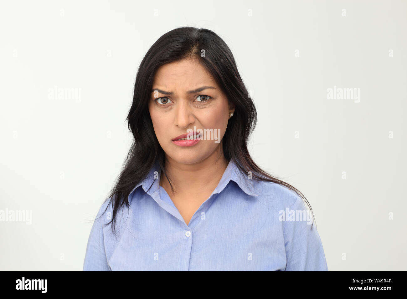 Portrait of a woman grimacing Stock Photo - Alamy