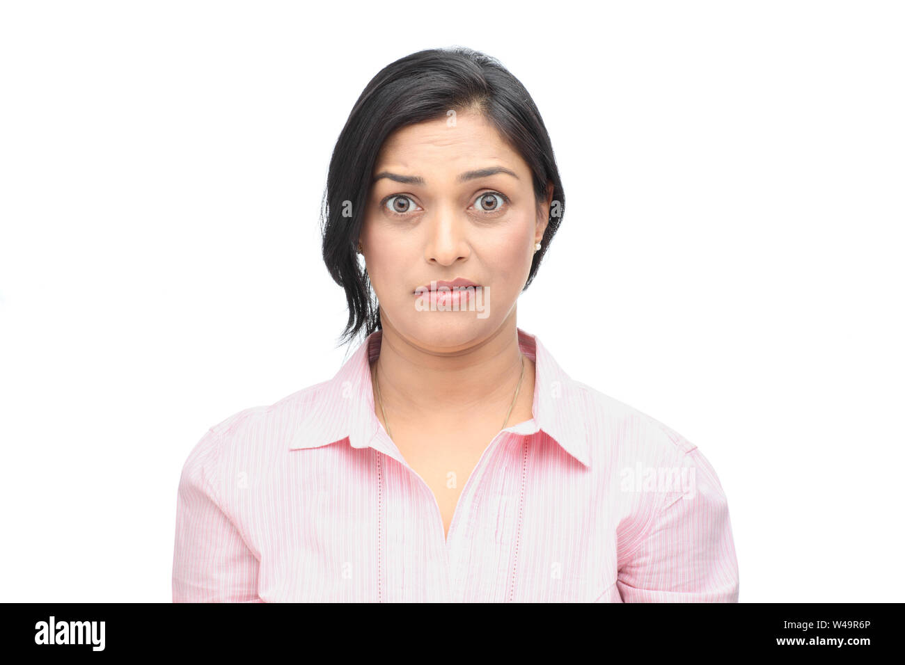 Portrait of an Indian woman looking scared Stock Photo - Alamy