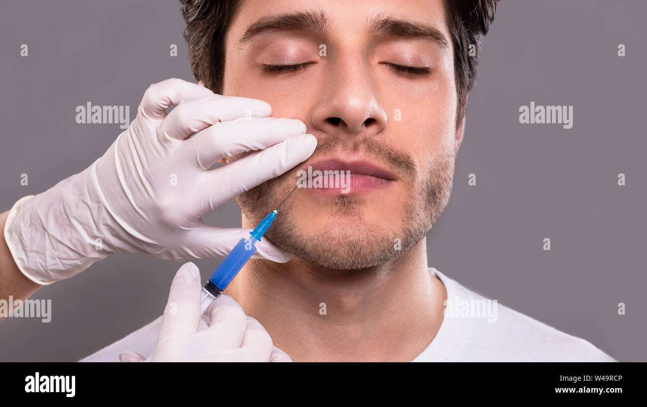 Portrait man receiving injection hi-res stock photography and images - Alamy