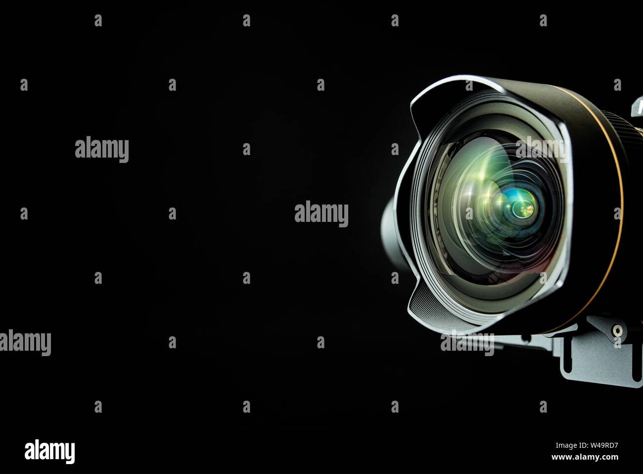 Close-up of wide angle lens in a dsl camera and gimbal stabilizer, with ...