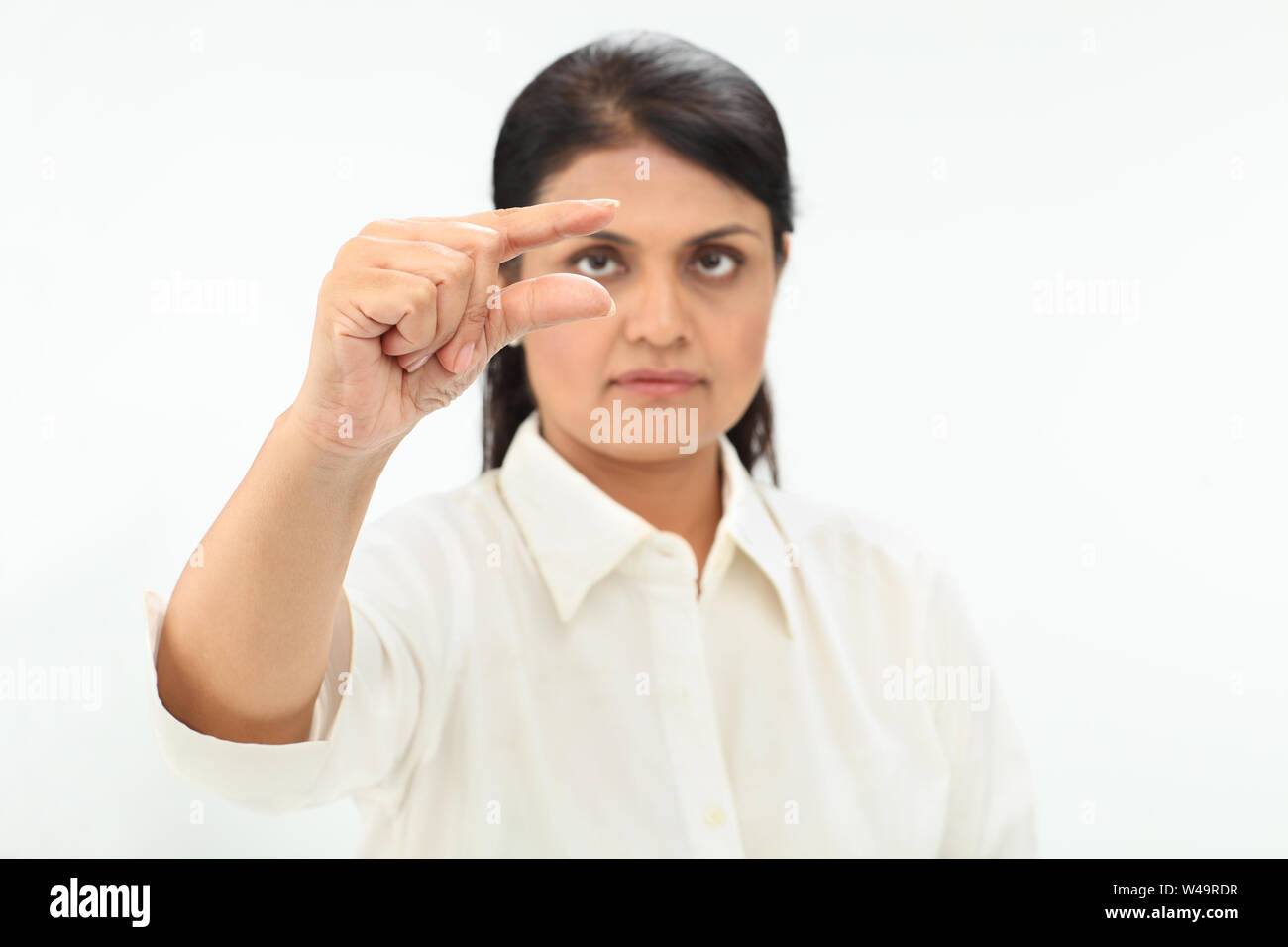 Woman gesturing middle fingers hi-res stock photography and images - Alamy