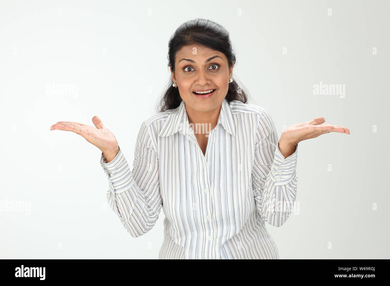 Portrait of a woman looking surprise Stock Photo - Alamy