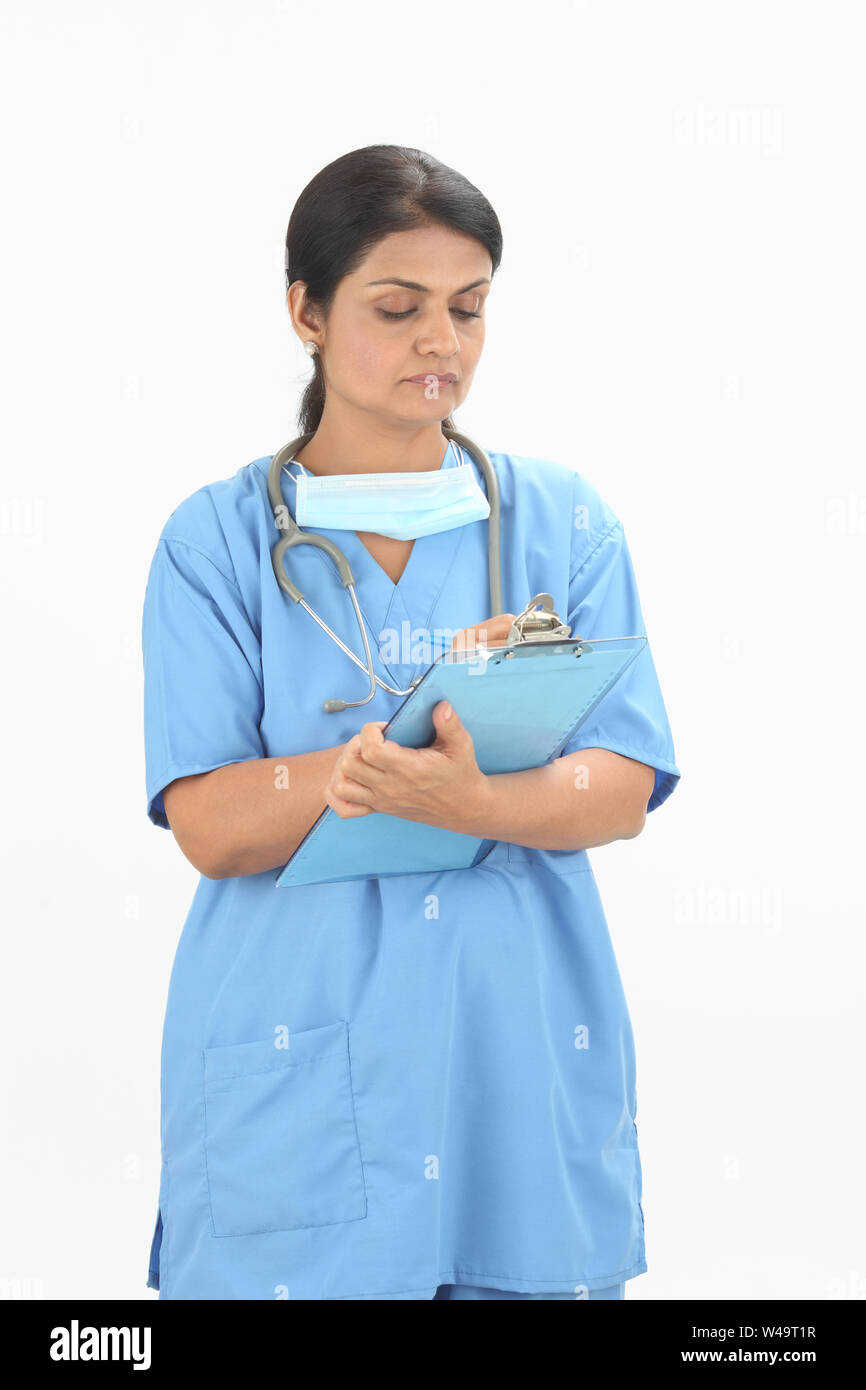 Indian female doctor writing prescription hi-res stock photography and ...