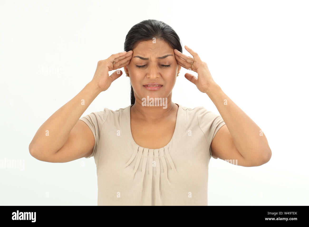 Indian woman suffering from headache Stock Photo - Alamy
