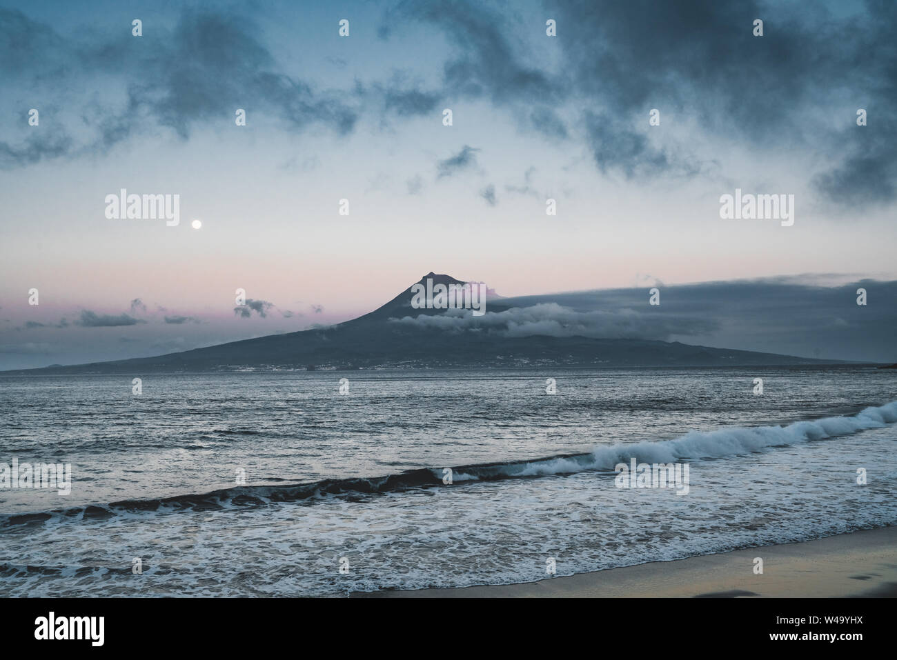 Mount Pico volcano western slope viewed from ocean with summit in ...