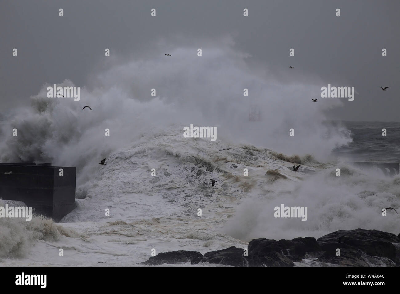 Big stormy waves and splash over pier Stock Photo - Alamy