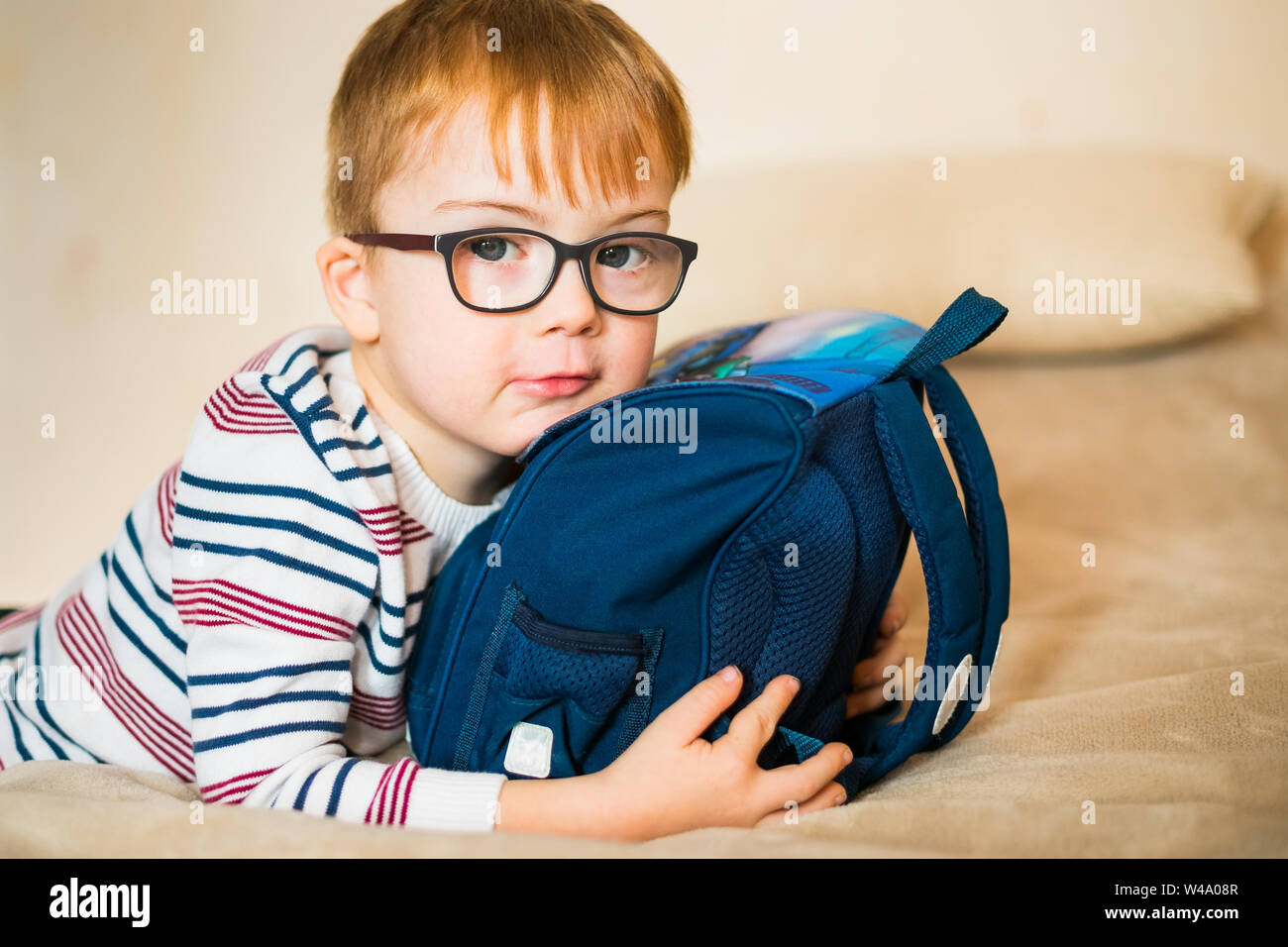 little ginger boy in the glasses with syndrome dawn playing with ...
