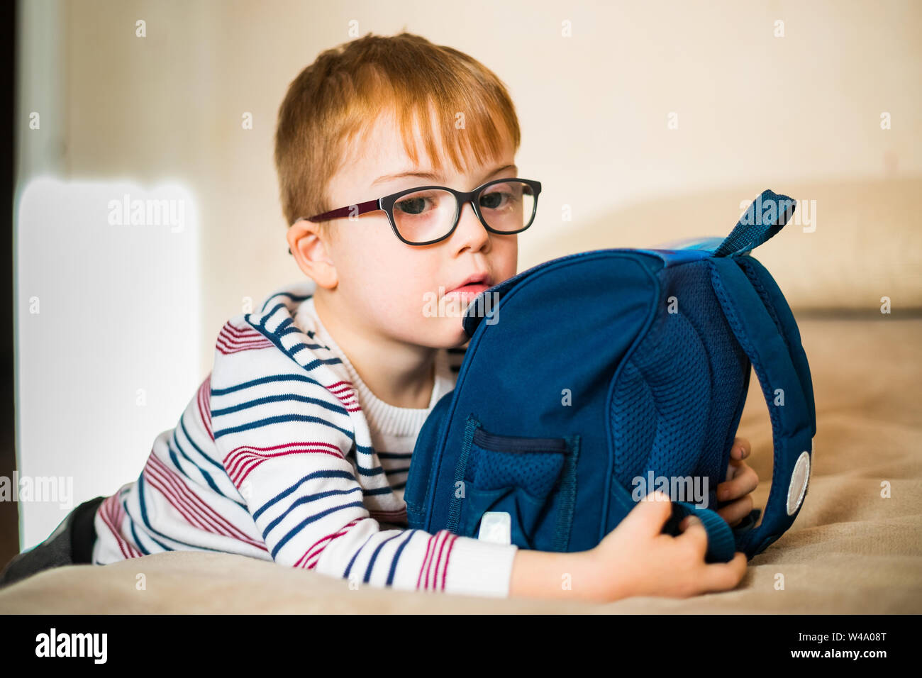 little ginger boy in the glasses with syndrome dawn playing with ...