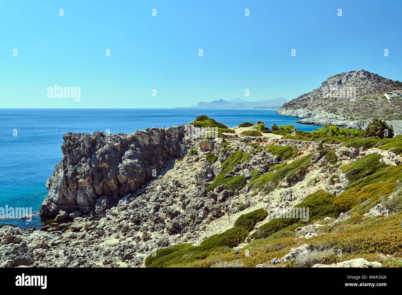 rocky cliff on the seacoast island of Rhodes Stock Photo - Alamy