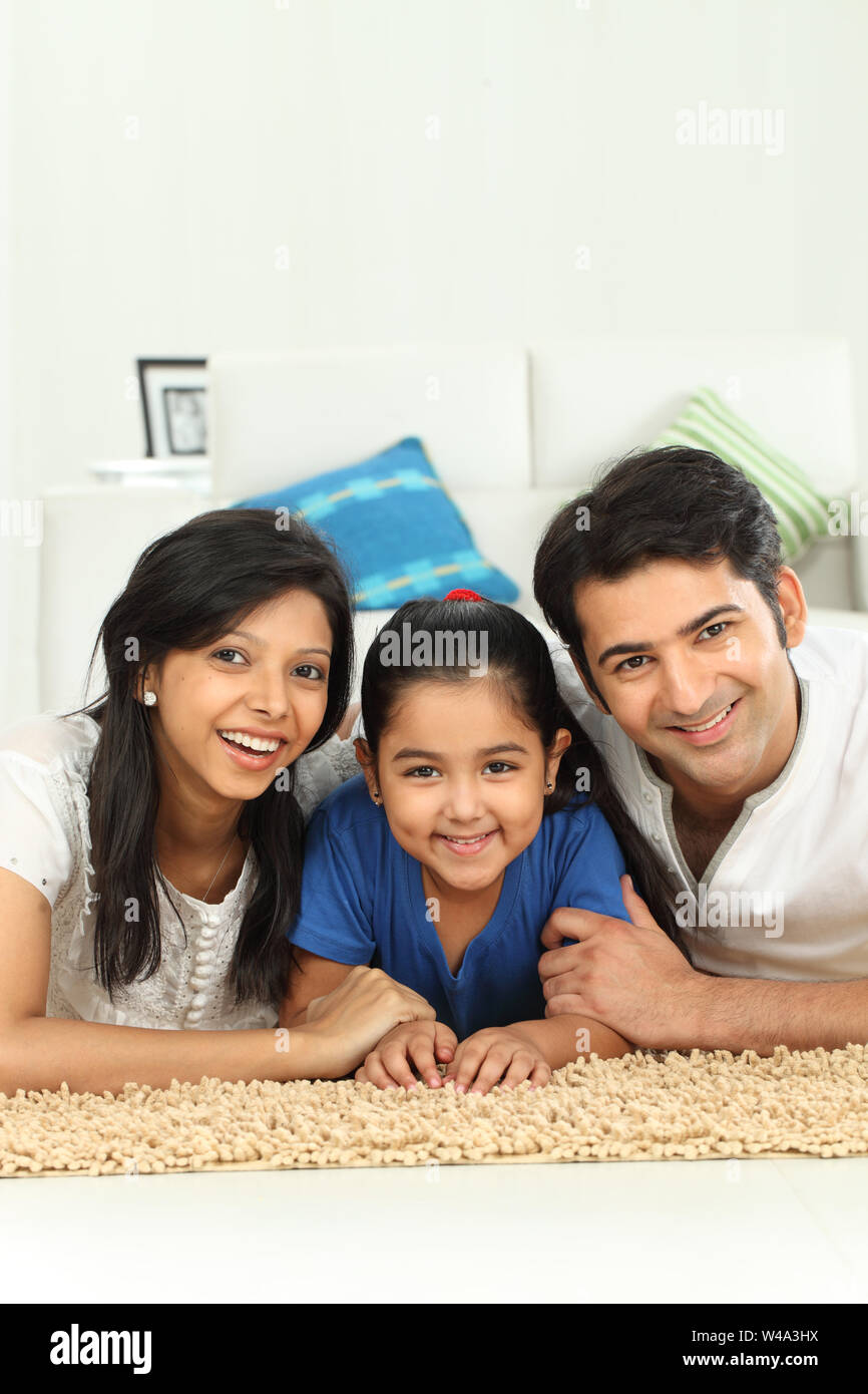 Family smiling at home Stock Photo - Alamy