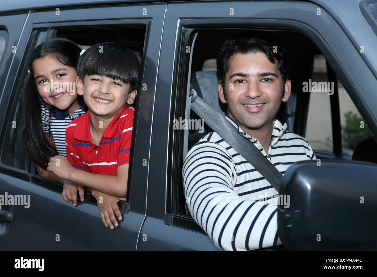 Indian boy driving a car hi-res stock photography and images - Alamy
