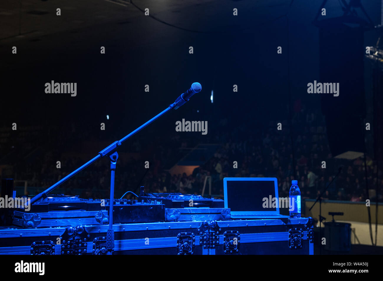 microphone in concert hall with blue lights Stock Photo - Alamy