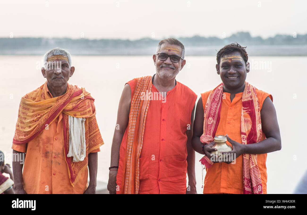 Three Indian pilgrims who reached Varanasi and the holy river Ganges ...