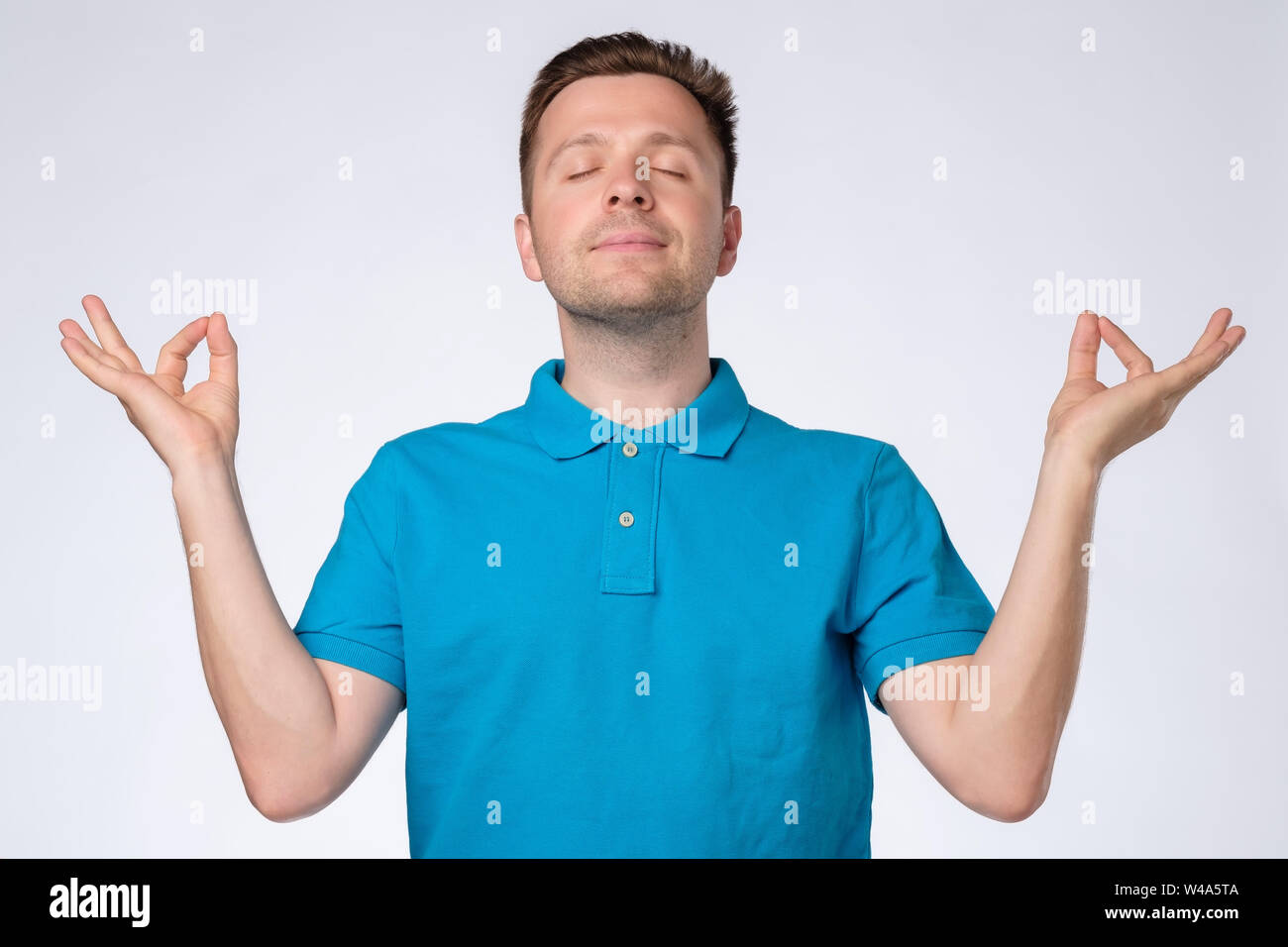 One handsome man meditating hi-res stock photography and images - Alamy