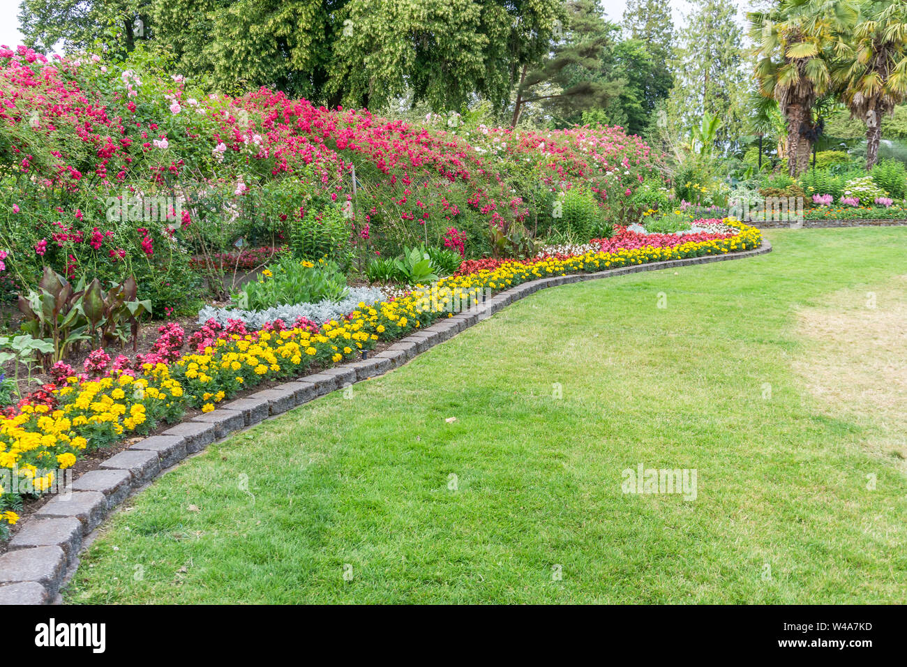 A view of a lawn and flower garden at Point Defiance Park in Tacoma ...