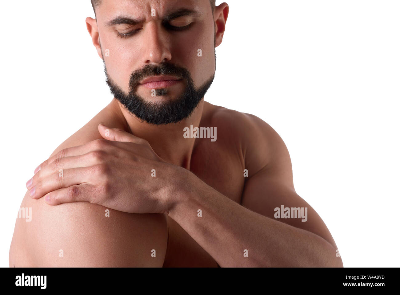 Muscular strong man with shoulder pain, isolated on white background ...