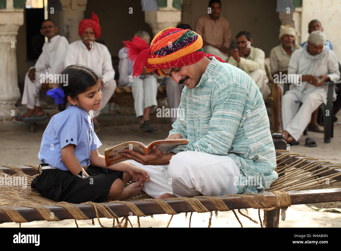 Man teaching his daughter Stock Photo - Alamy