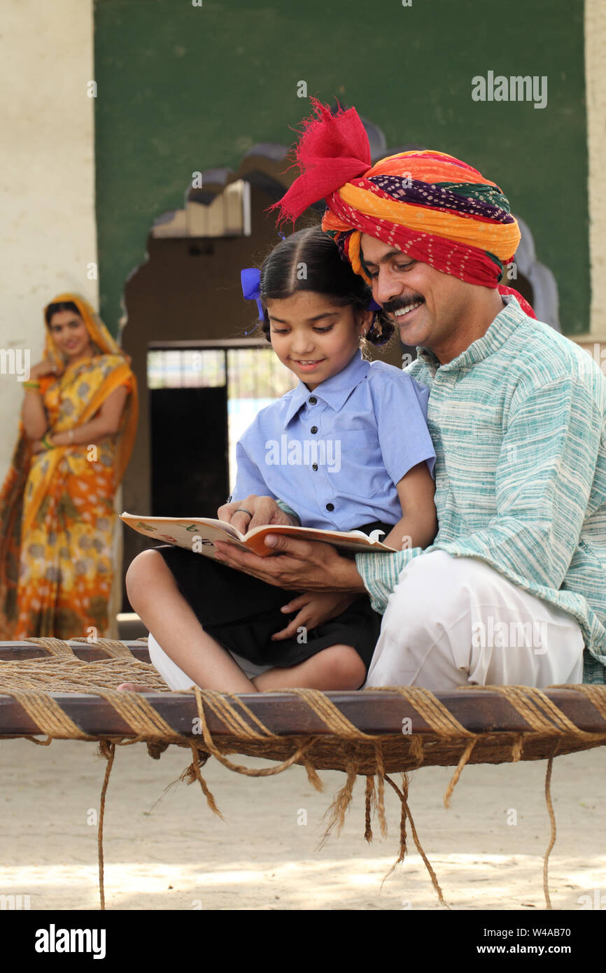 Man teaching his daughter Stock Photo - Alamy