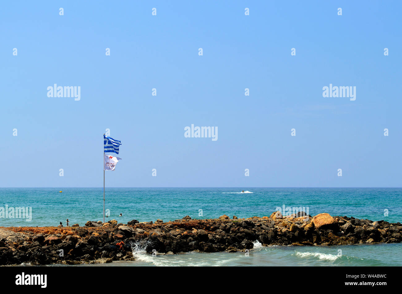 Greek flag flying in Gouves old harbour in Crete the largest and most ...
