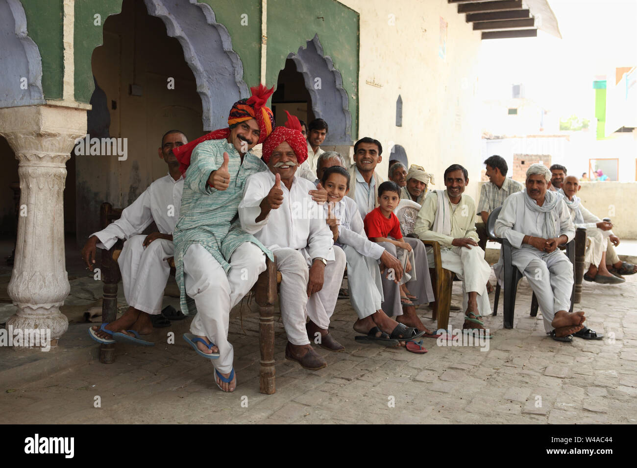 Group of rural people sitting together Stock Photo - Alamy