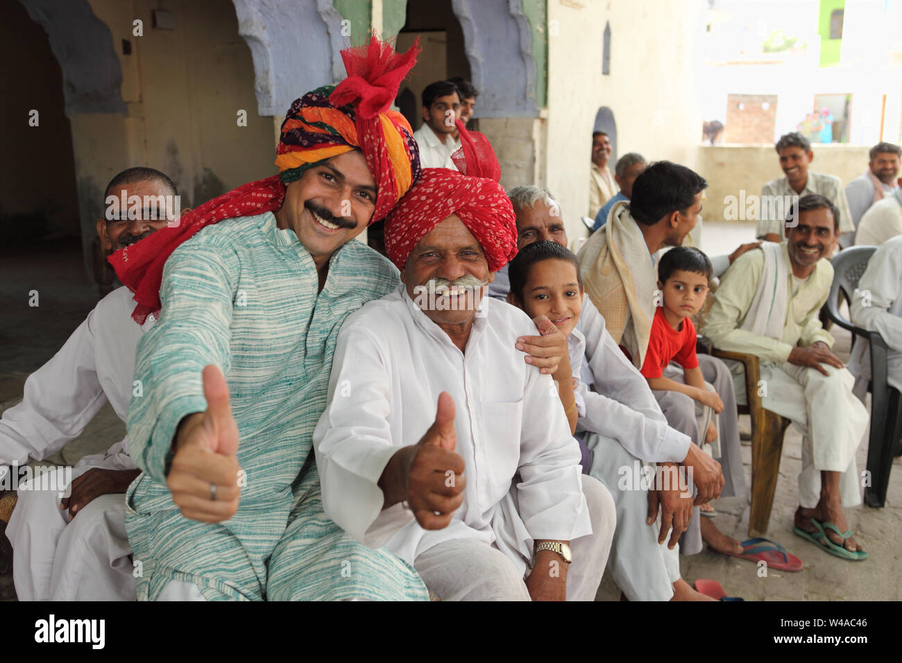 Group of rural people sitting together Stock Photo - Alamy