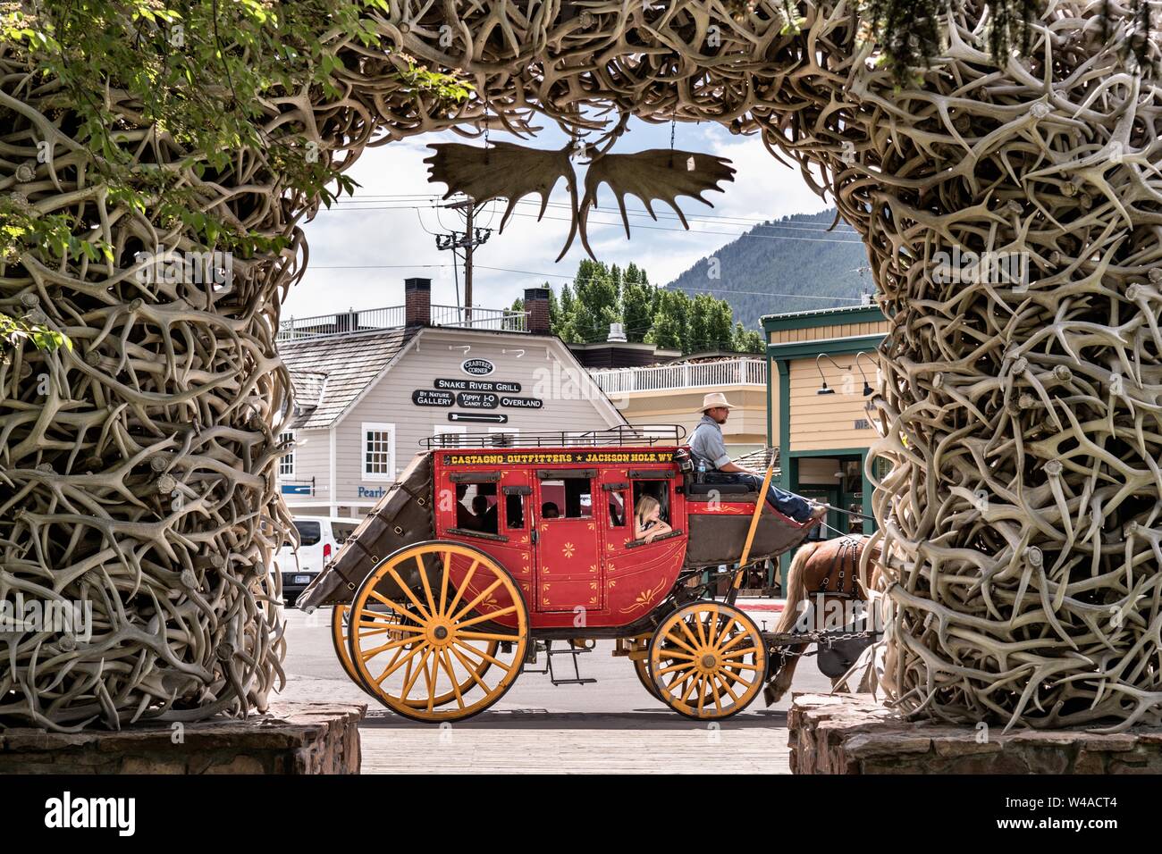 A tourists stagecoach the Elk Antler Arch in George Washington Memorial ...