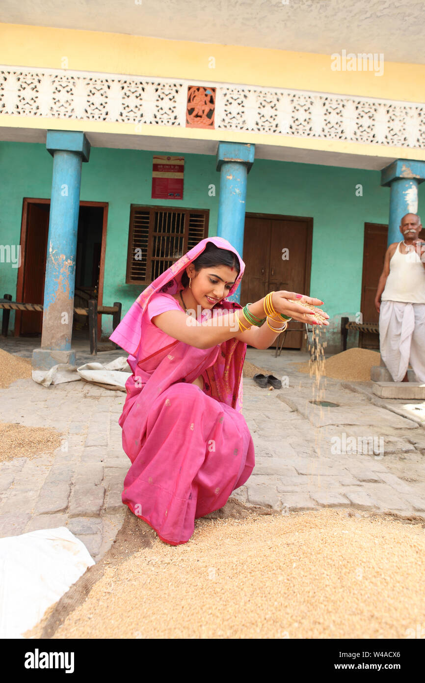 Woman winnowing wheat hi-res stock photography and images - Alamy