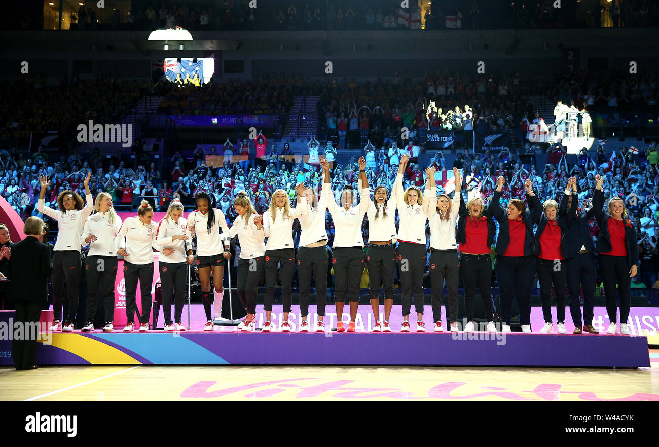 England players celebrate on the podium after finishing third place in ...