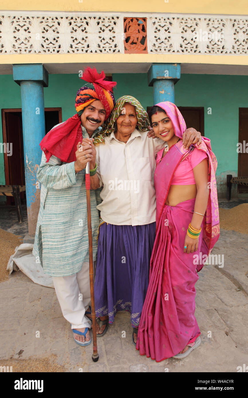 Rural family standing together and smiling Stock Photo - Alamy