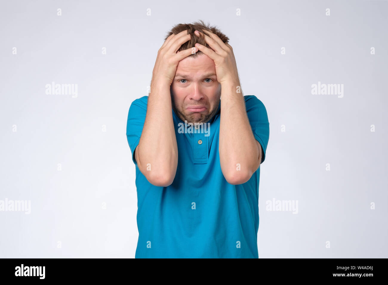 Miserable sad man being offended and upset expressing negative emotions ...