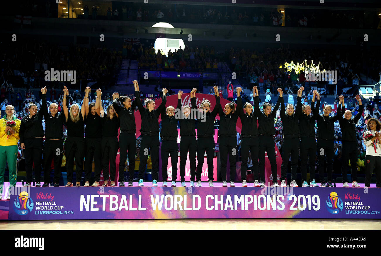New Zealand players celebrate on the podium after winning the Netball ...