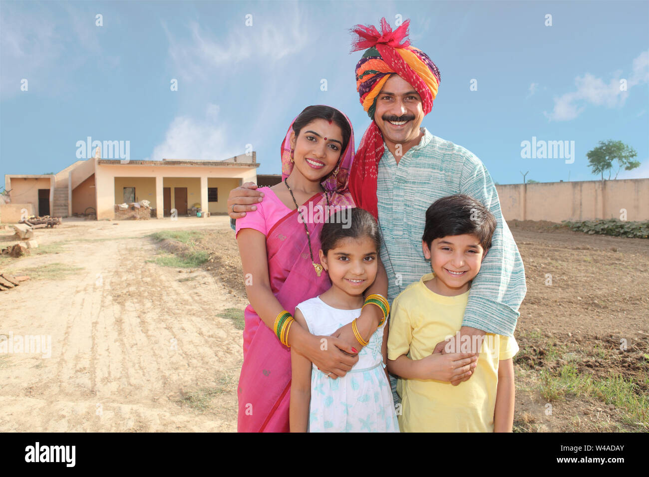 Portrait of a rural family smiling Stock Photo - Alamy