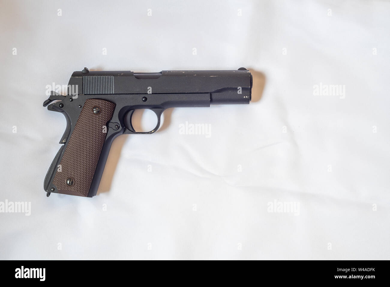 Handgun without magazine on white background Stock Photo - Alamy