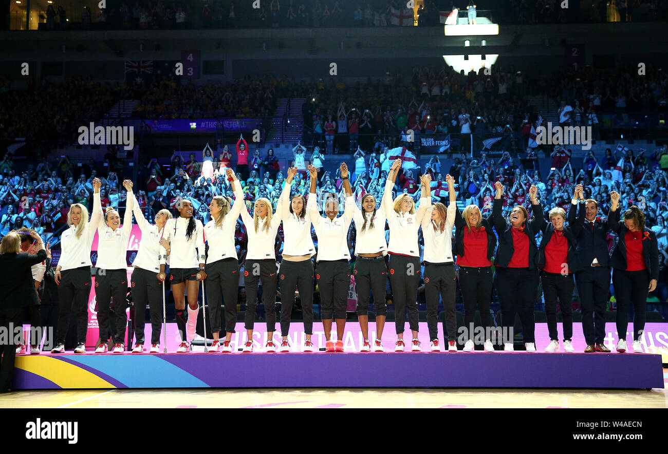 England players celebrate on the podium after finishing third place in ...