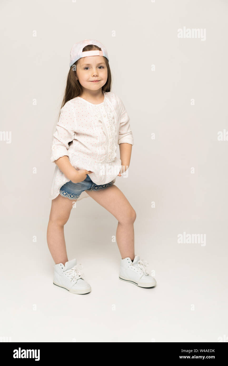 Cute girl 5-6 year old posing in studio Stock Photo - Alamy