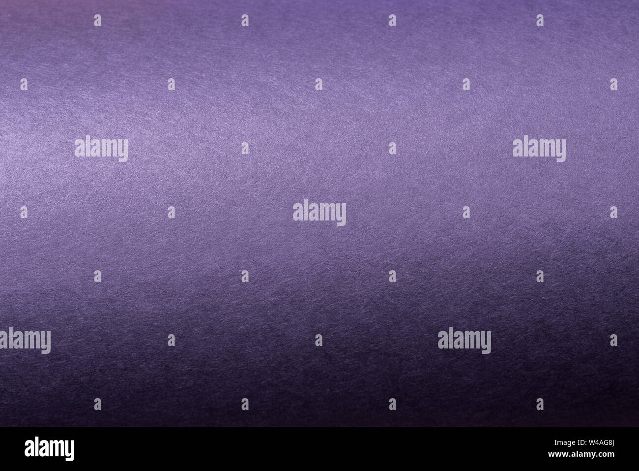 violet color roller made with curved sheets of paper background texture ...