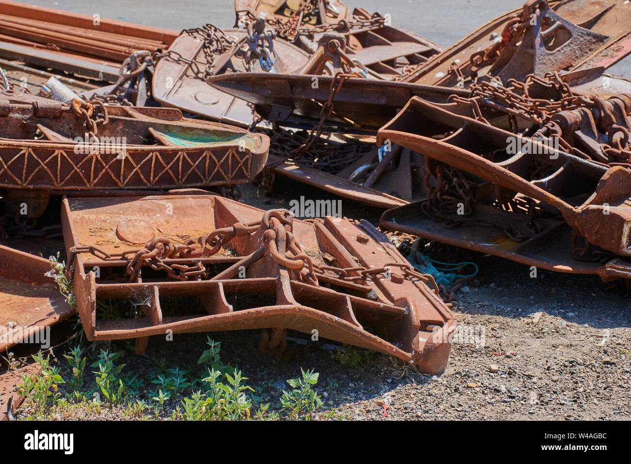 scrap metal parts of boats lying around Stock Photo - Alamy