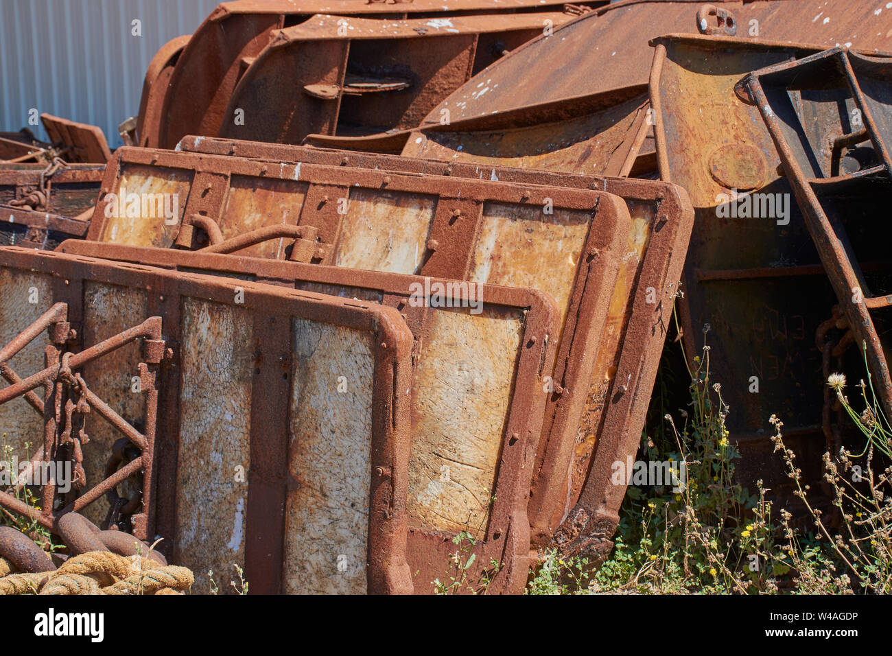 scrap metal parts of boats lying around Stock Photo - Alamy