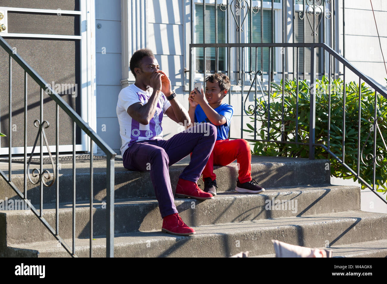 Bryan Hamilton and his son Rafiki, age 8, enjoy the Seattle Matsuri ...