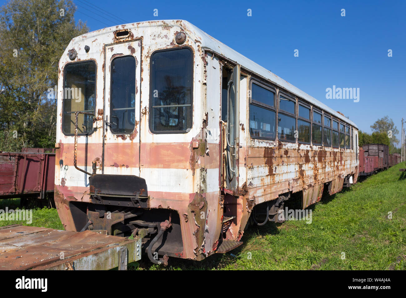 Old ruined steel passenger car. Rusty train on railway tracks Stock ...