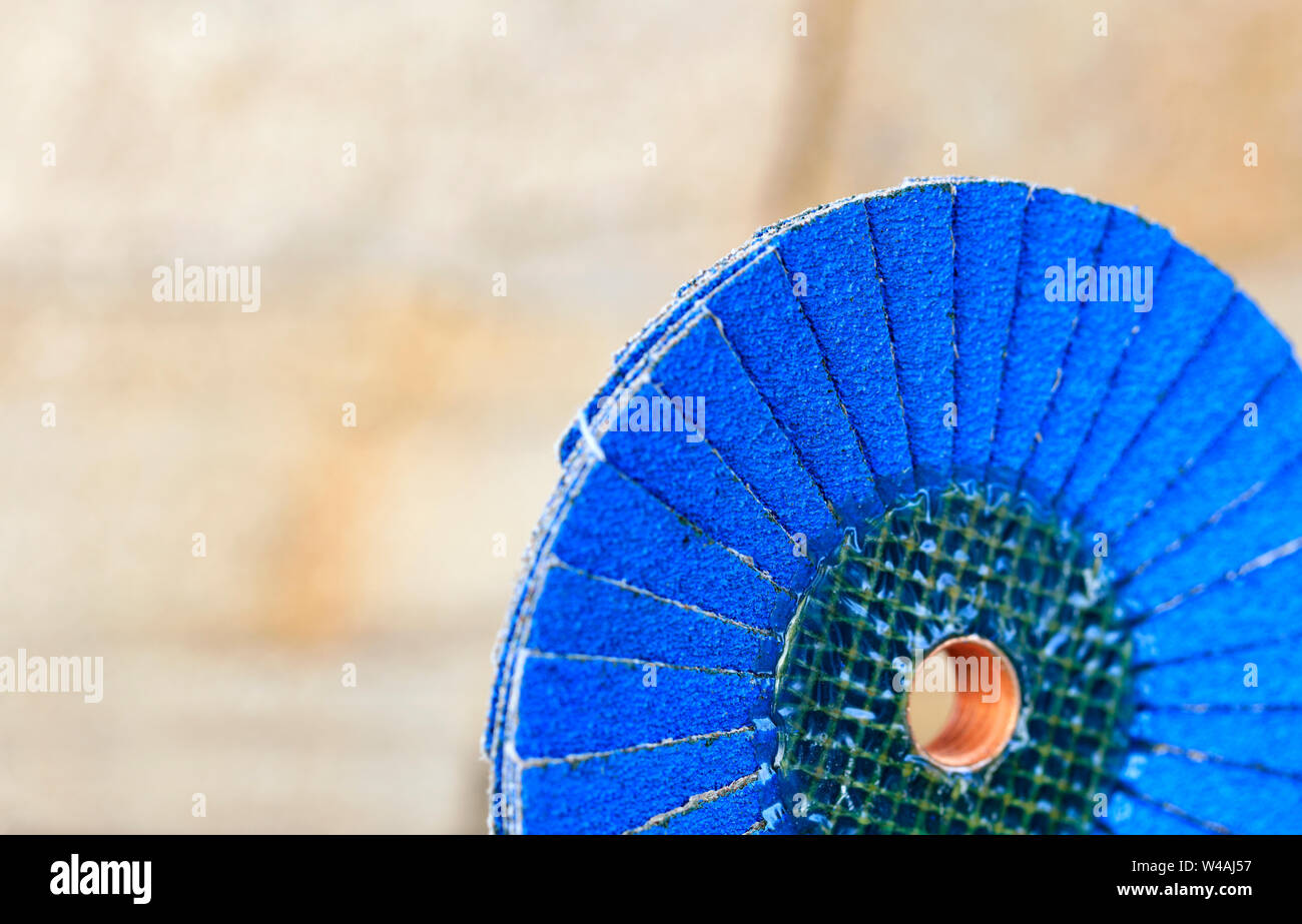 A part of a petal grinding wheel of blue color for sanding wood and ...