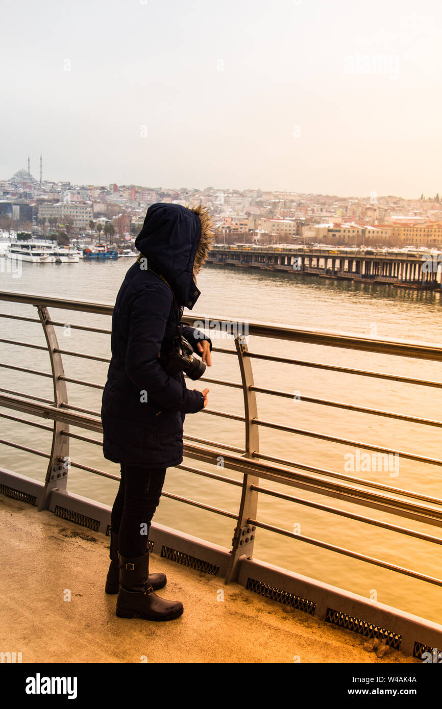 tourist girl photographer with dslr camera outdoor on the bridge in ...