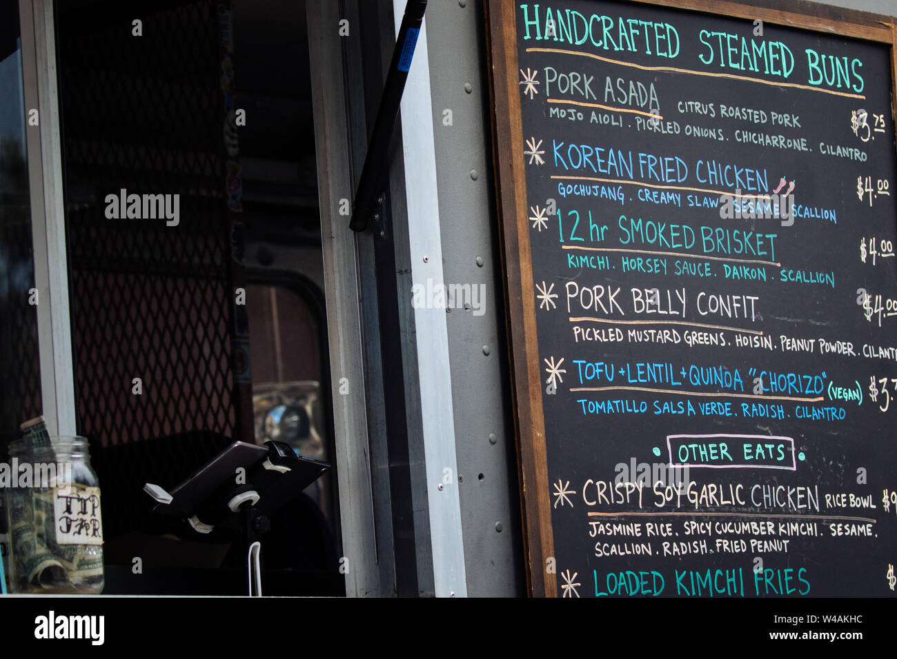 Food trucks gather for a festival in Sanford, Florida. Menu board with ...