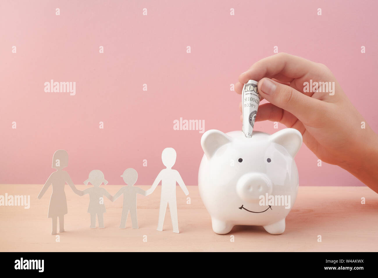 Piggy bank family hi-res stock photography and images - Alamy
