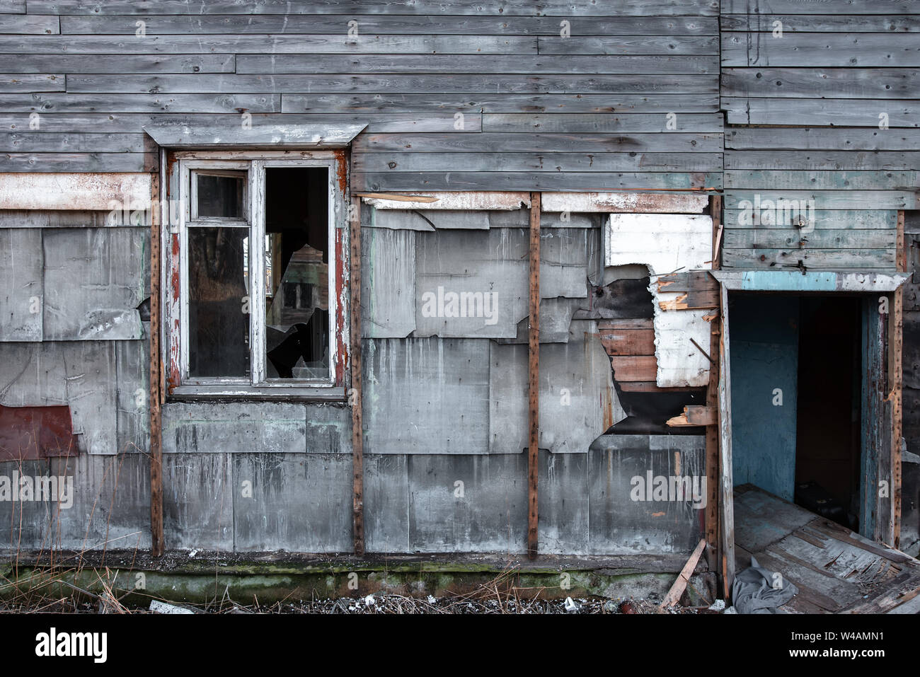 Old destroyed abandoned dirty raw wooden house with the broken out ...