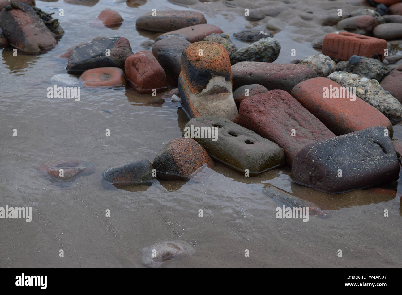 Sea worn bricks Stock Photo - Alamy